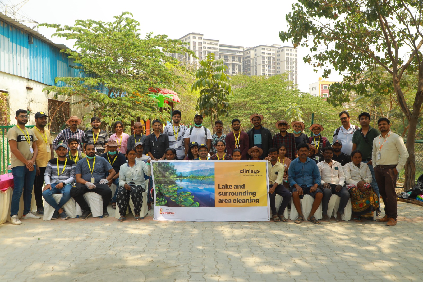 Employees volunteer to clean lake in the community to spread awareness ...